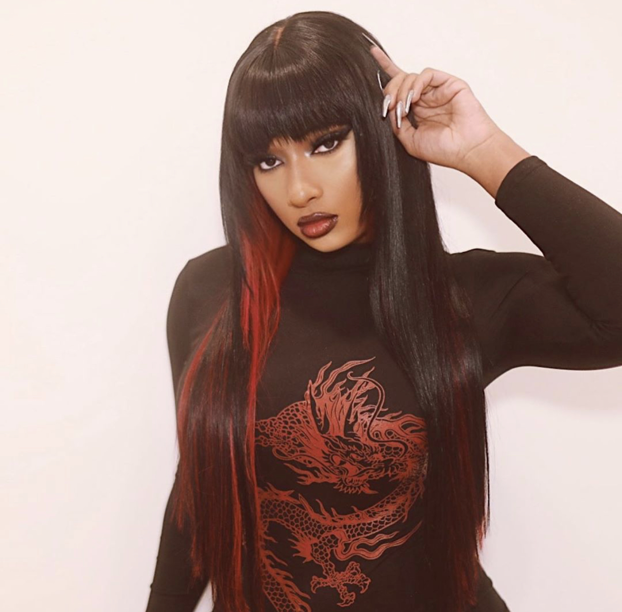 Megan Thee Stallion Delivers Fiery Look in Fashion Nova Romper ...