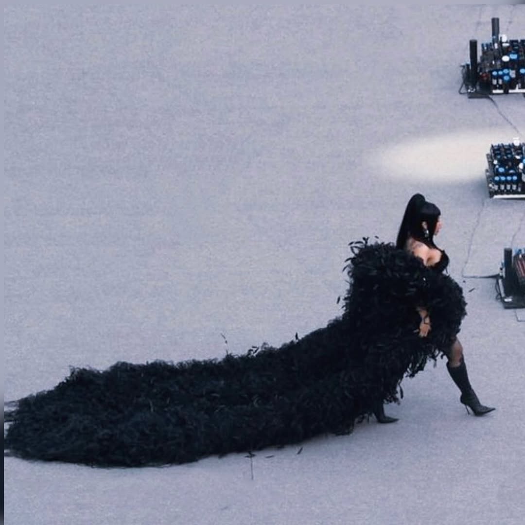 Cardi B Stuns in Custom Black Feather Corset, Dramatic Cape, and Le ...